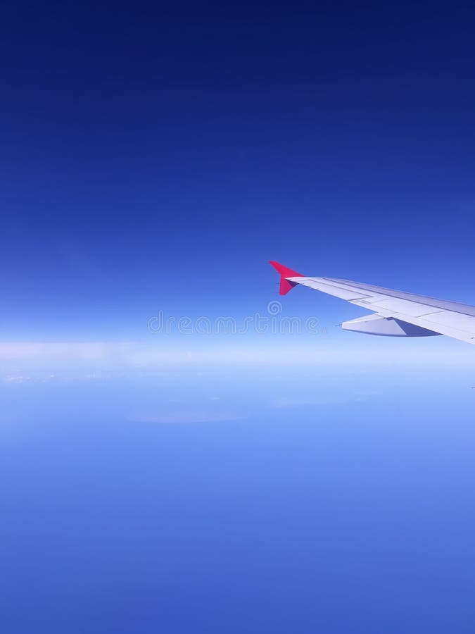 The View of the Clear Blue Sky from Inside the Airplain. Stock Photo ...