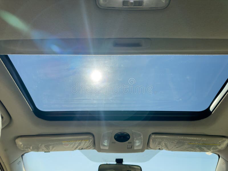 View of the Clear Sky through the Open Sunroof Hatch of a Car on a ...