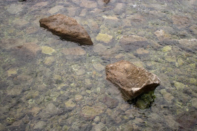 Stones in the water. stock photo. Image of space, coral - 137354890