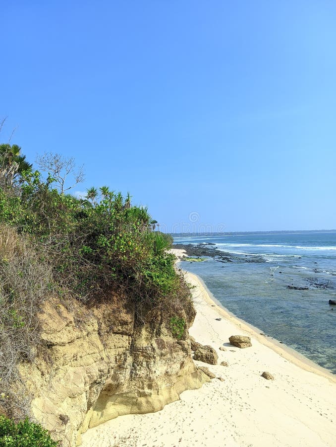 View of Cliffs on the Edge of a White Sand Beach Stock Image - Image of ...