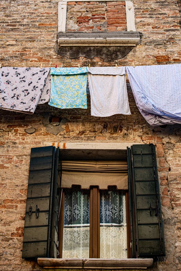 View of Clothesline Drying Against Wall and Windows Stock Image - Image ...