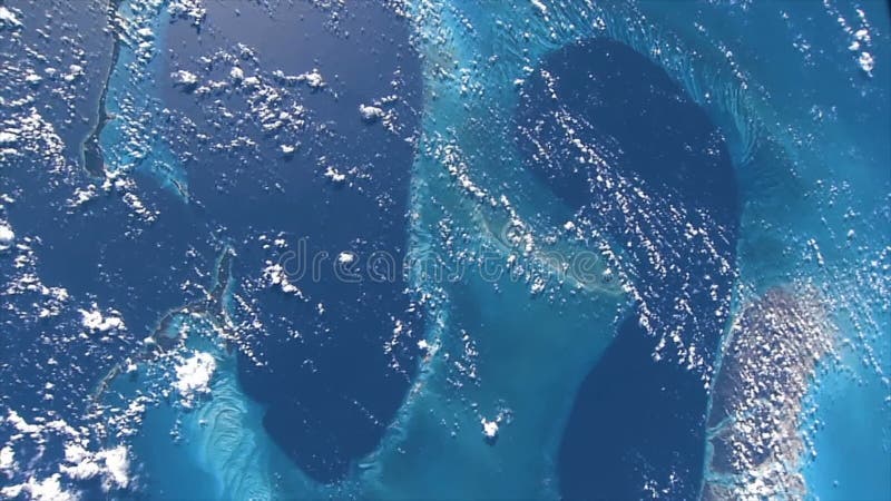 View of the Clouds and Blue Ocean Water from the Orbit in Bright ...