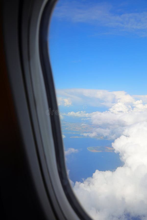View of Clouds from High Above an Airplane Window during a Transoceanic ...