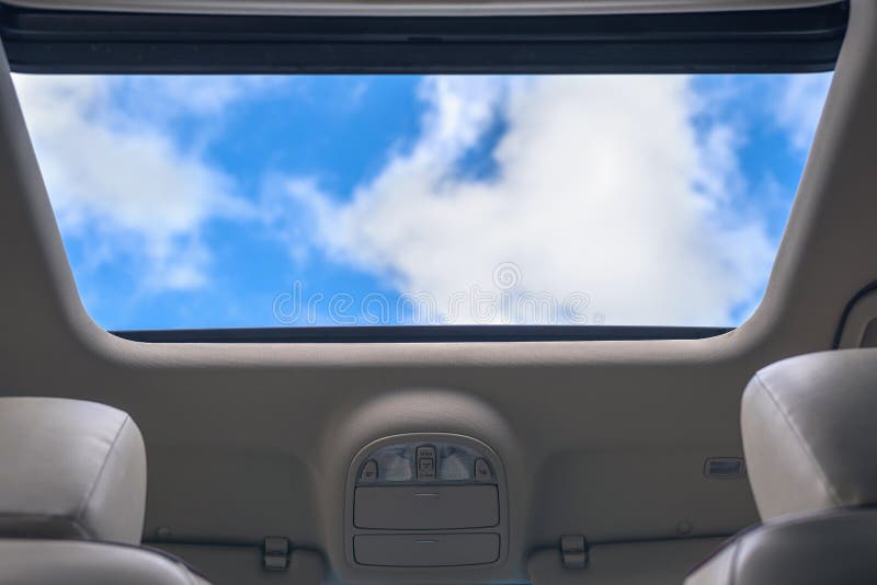View of the Cloudy Sky through the Open Hatch of the Car. Stock Photo ...