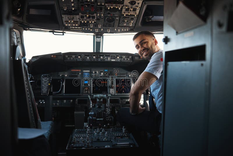 Mirthful Experienced Pilot Looking Happy at His Workplace Stock Image ...