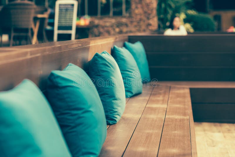 View of Comfortable Corner Couch with Many Pillows Outside on Loft ...