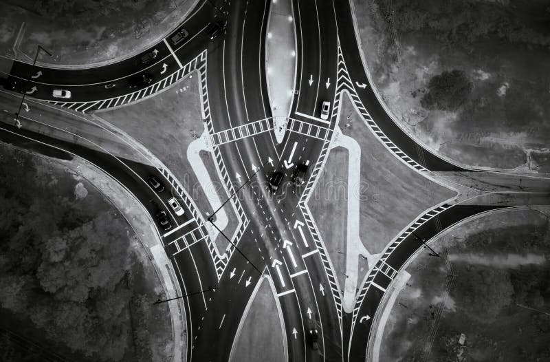 View of a Complex Road Intersection with Multiple Lanes and Vehicles in ...