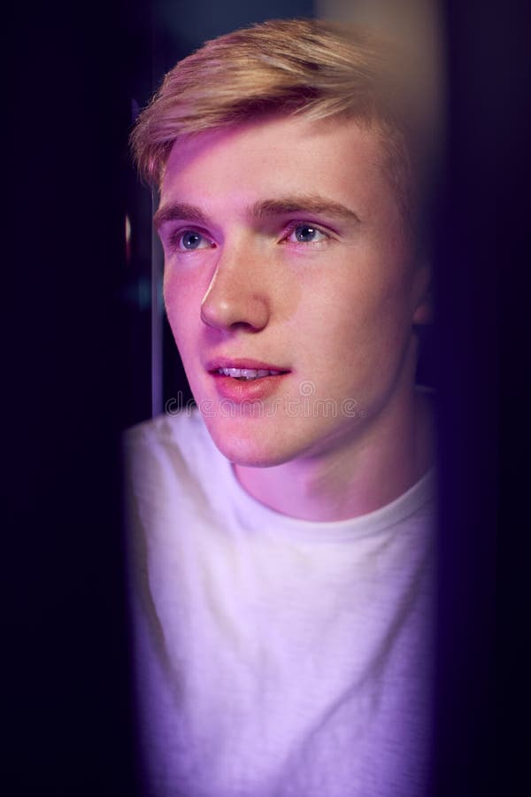 View between Computer Screens of Teenage Boy Gaming at Home Stock Photo ...