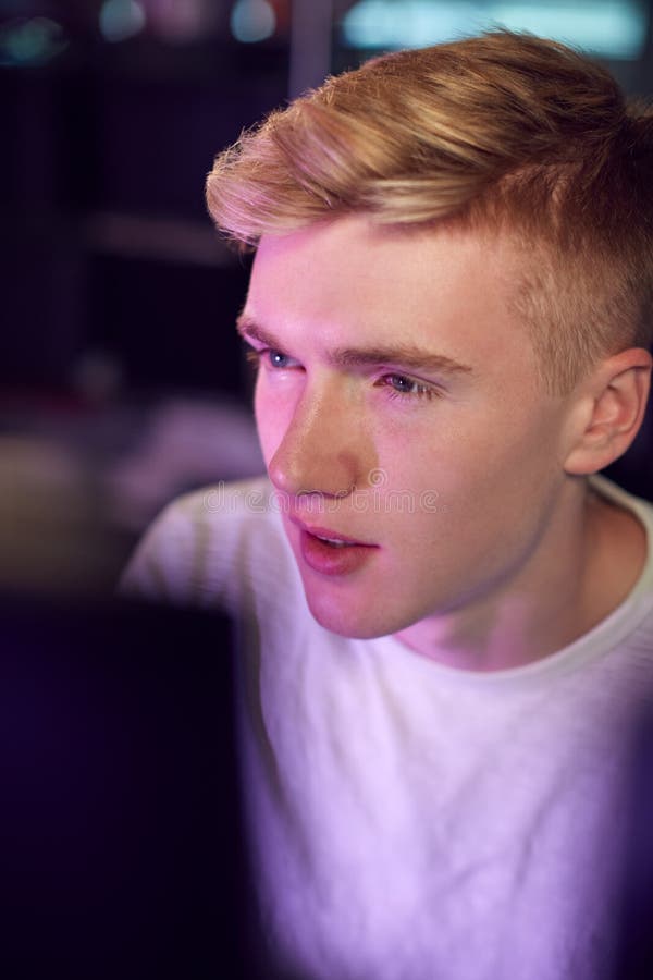 View between Computer Screens of Teenage Boy Gaming at Home Stock Photo ...