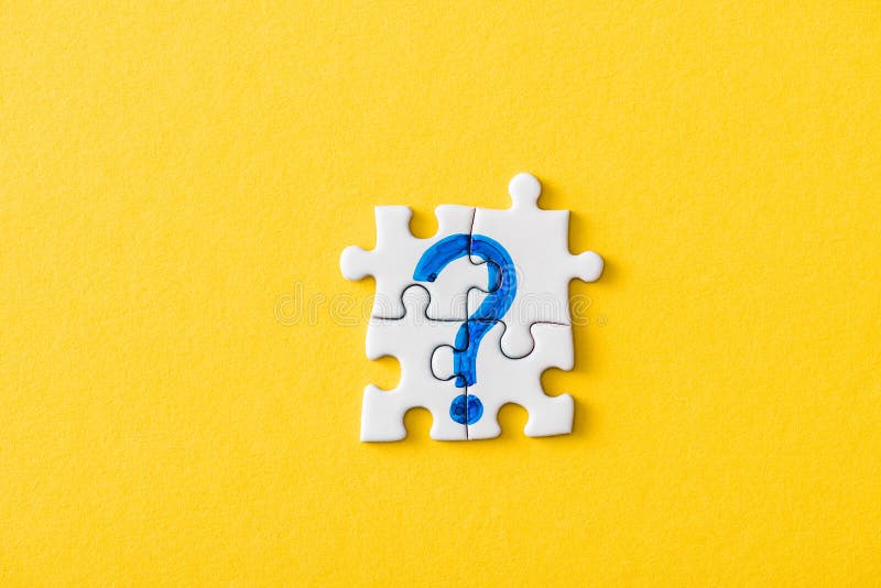 View of Connected Puzzle Pieces with Drawn Blue Question Mark on Yellow ...