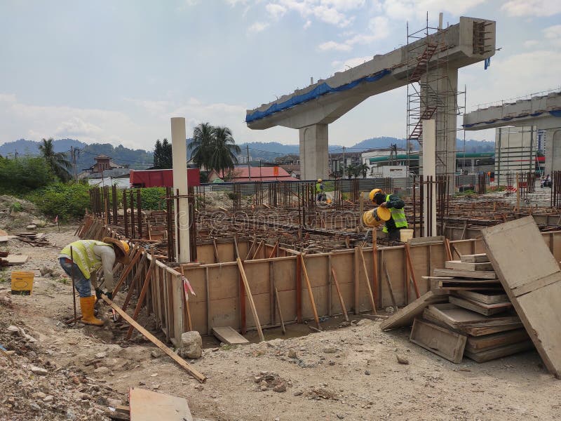 A View of a Construction Site in Full Swing. Machines and Workers are ...