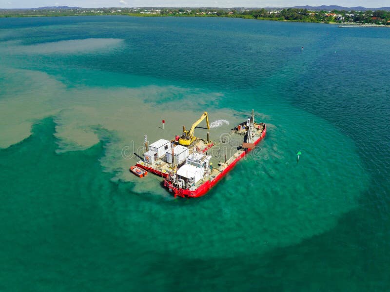 View of the Container Ship on the Turquoise Water Surface. Sand ...