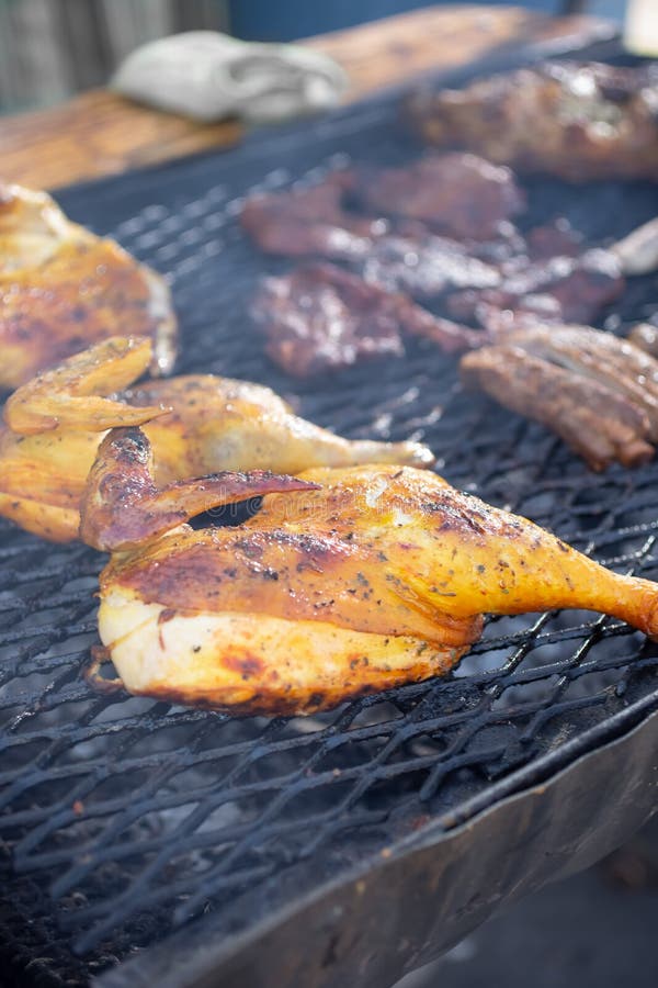 Pollo asado on the grill stock photo. Image of butcher - 254818926