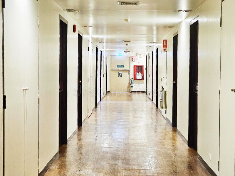 Hotel Corridor Hallway Has Signs and Fire Escape Doors in the Building ...