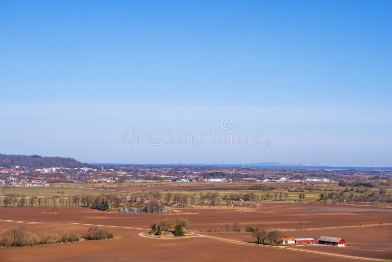 View of the Countryside in Spring with a Town Stock Photo - Image of ...