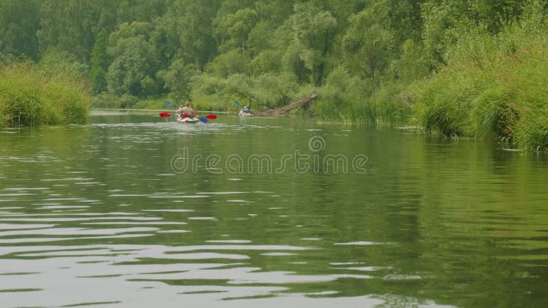 View of Couple in Canoe Drafting on River Vorya on Summer Day Stock ...