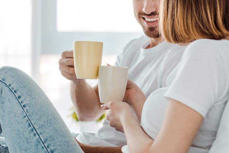 View of Couple Drinking Coffee at Home Stock Image - Image of jeans ...