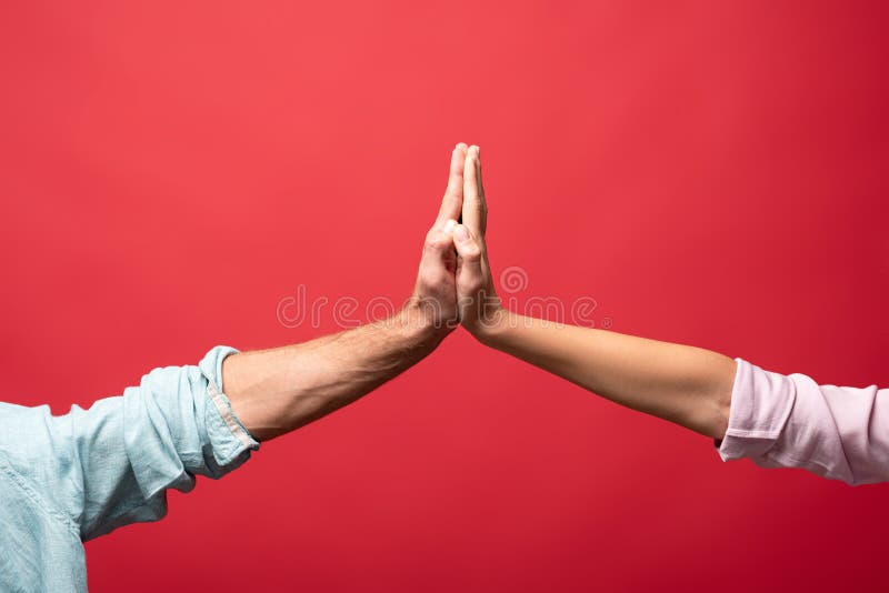 View of Couple Giving High Five, Isolated on Red Stock Image - Image of ...