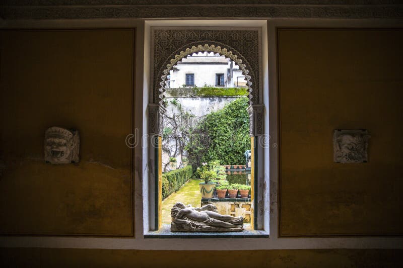View of a Courtyard through an Arched Window in Alhambra Stock Photo ...
