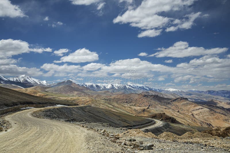 View of Curved Road among Snow Capped Mountains Stock Photo - Image of ...