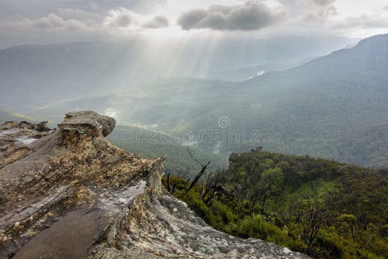 View of Deep Valley and Rolling Hills from a Rocky Cliff Edge Stock ...