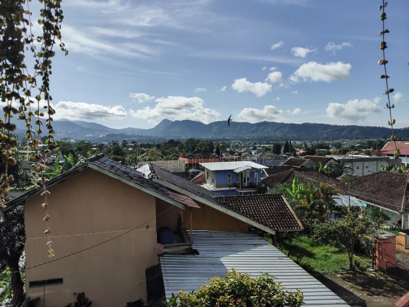 A View of Dense Housing with a Mountainous Background Stock Photo ...