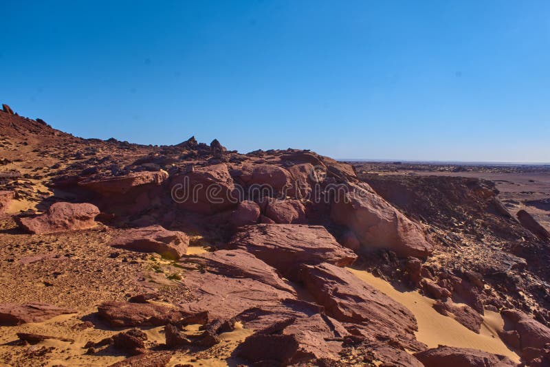 View of a Desert Land with Dark Rocks Stock Image - Image of mountain ...