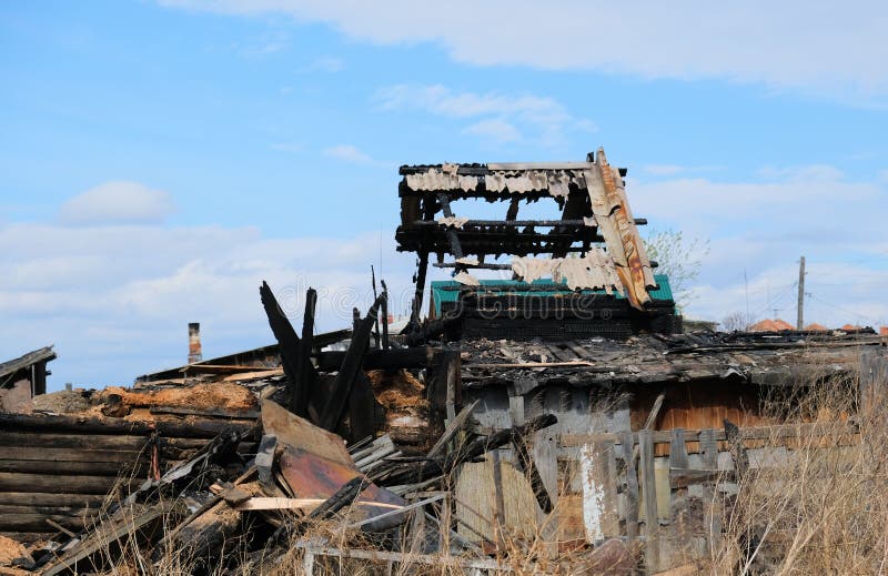 View of a Deserted Run Down Wooden Village House after a Fire Stock ...