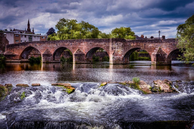 View of Devorgilla Bridge with River Flowing Over Rocks Stock Image ...