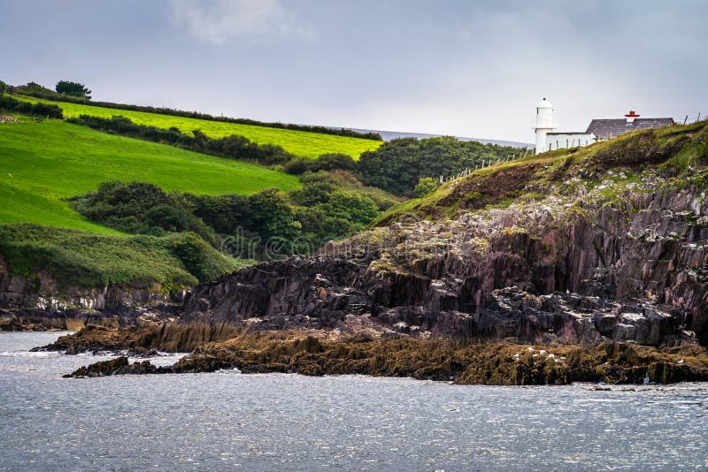 View on Dingle Bay and Lighthouse in Co. Kerry, Ireland Stock Photo ...