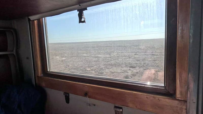 View through the Dirty Window of a Long-distance Moving Train on the ...