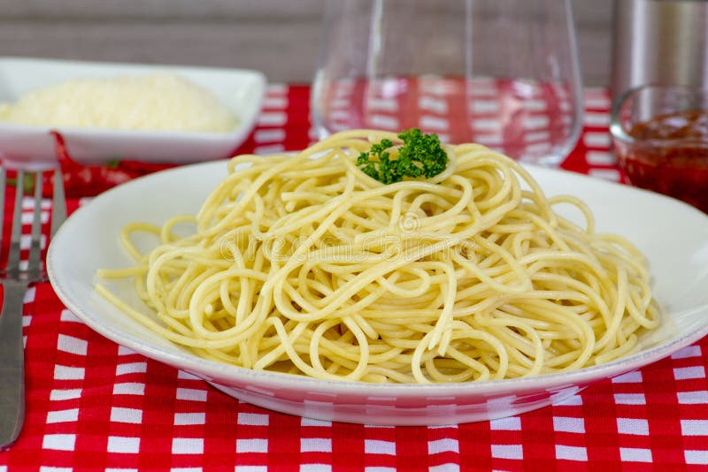 Dish of Plain Cooked Spaghetti on a Table Stock Image - Image of plate ...