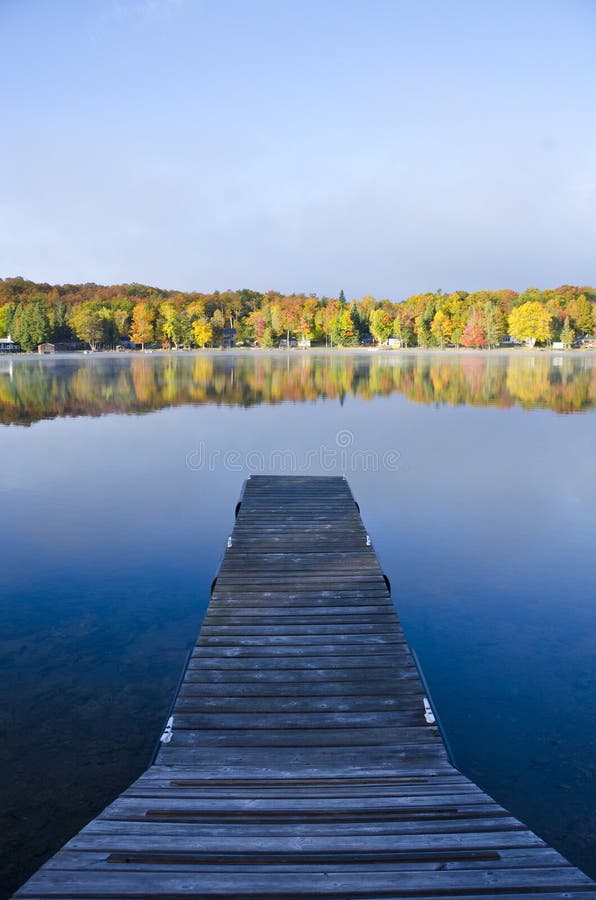 View of a Dock and Colorful Trees on the Lake Stock Photo - Image of ...