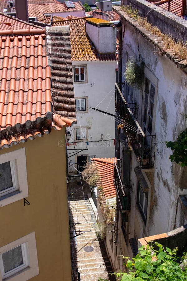 View Down a Narrow Street Lined with Old Buildings and Terracotta ...