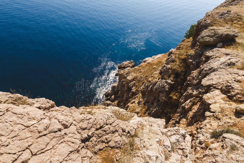 View Down To the Sea from a Cliff Stock Photo - Image of mountain ...