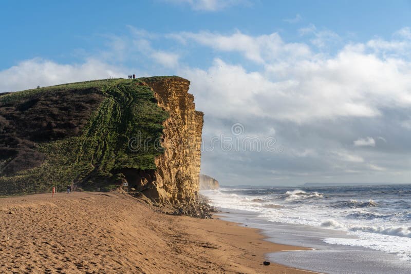 A View of the Dramatic Sunlit Cliffs at West Bay, Dorset, UK. Stock ...