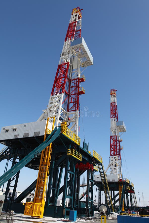 Drilling rig in the clouds stock photo. Image of slide - 30033396