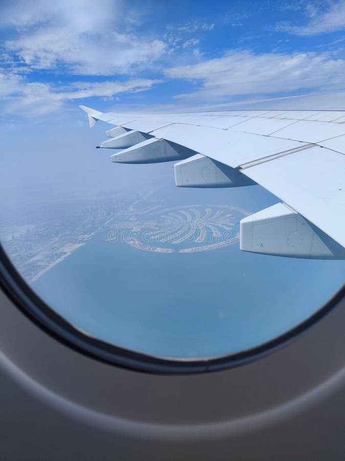 View of Dubai and the Sandy Coast, through the Window of a Flying ...
