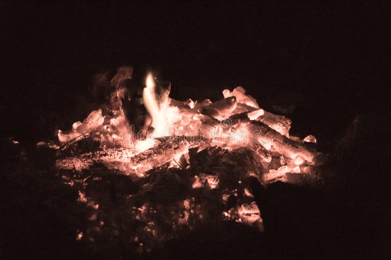 A Dying Bonfire Ready for Snuffing on Black Background Stock Image ...