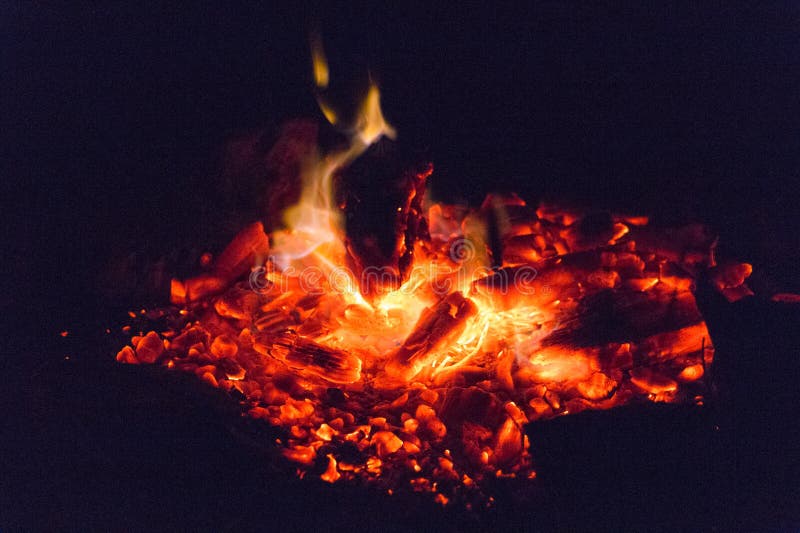 A Dying Bonfire Ready for Snuffing on Black Background Stock Photo ...