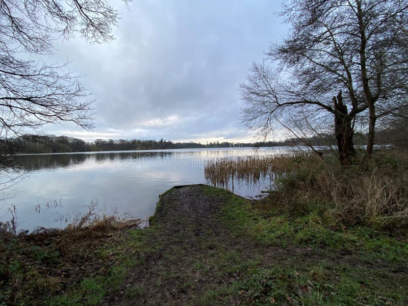 Ellesmere Lake And Lone Park Bench, Shropshire, England Stock Image ...