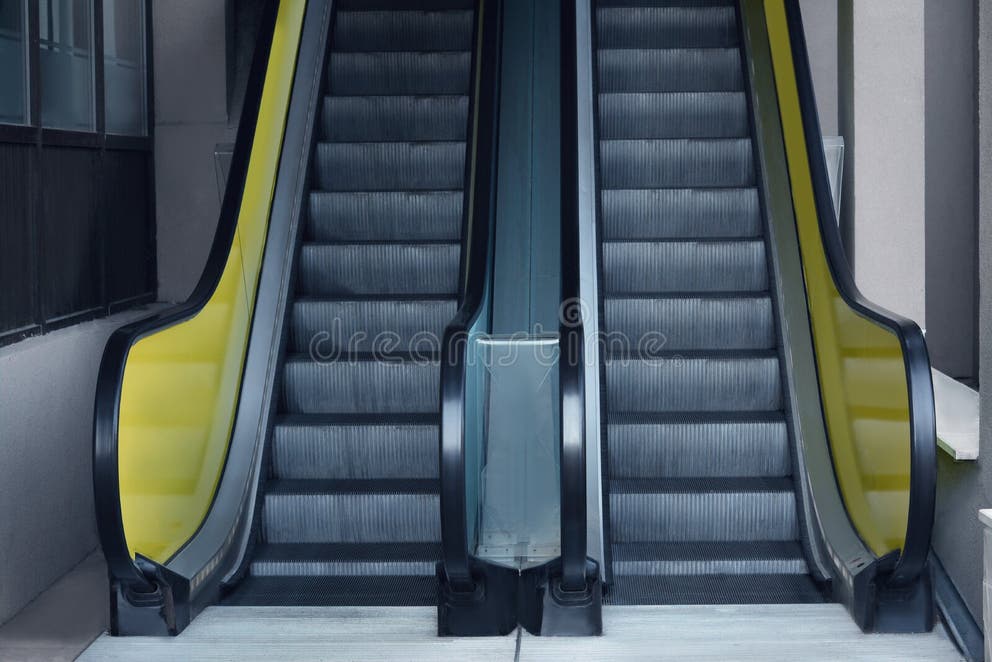 View on Empty Parallel Escalators with Yellow Balustrades Stock Photo ...