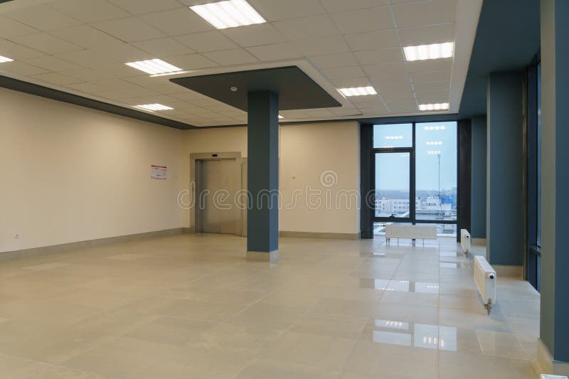 View of an Empty Spacious Hall with Columns and Panoramic Windows ...