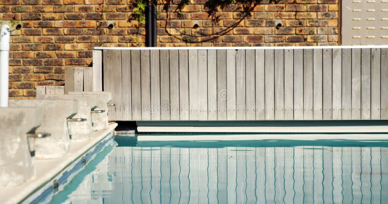 An Empty Swimming Pool with Many Lanes that is Separated by Red Pool ...