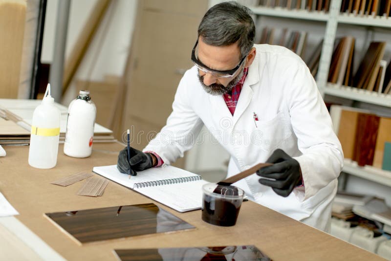 Engineer in the Laboratory Examines Ceramic Tiles Stock Image - Image ...