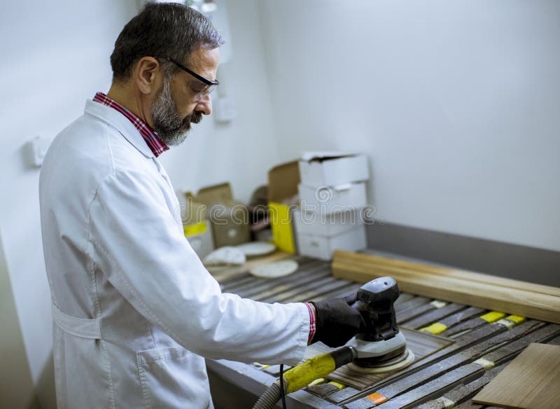 View at Engineer in the Laboratory Examines Ceramic Tiles Stock Image ...