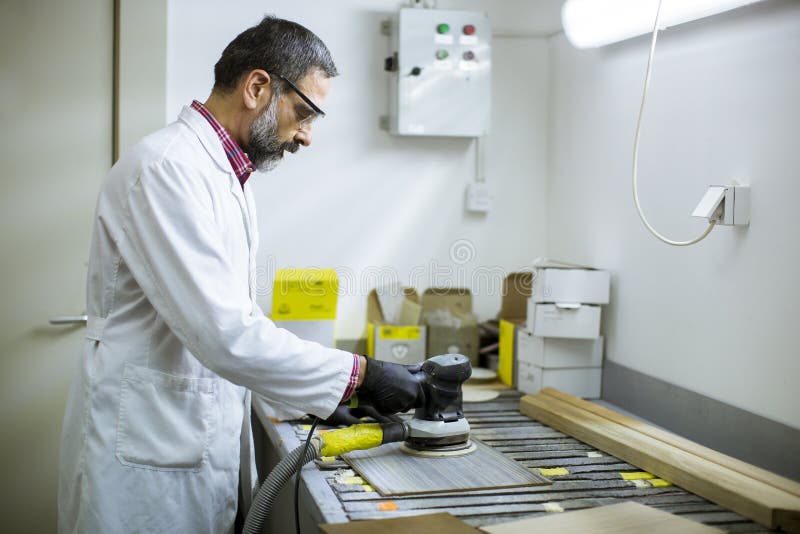 View at Engineer in the Laboratory Examines Ceramic Tiles Stock Photo ...