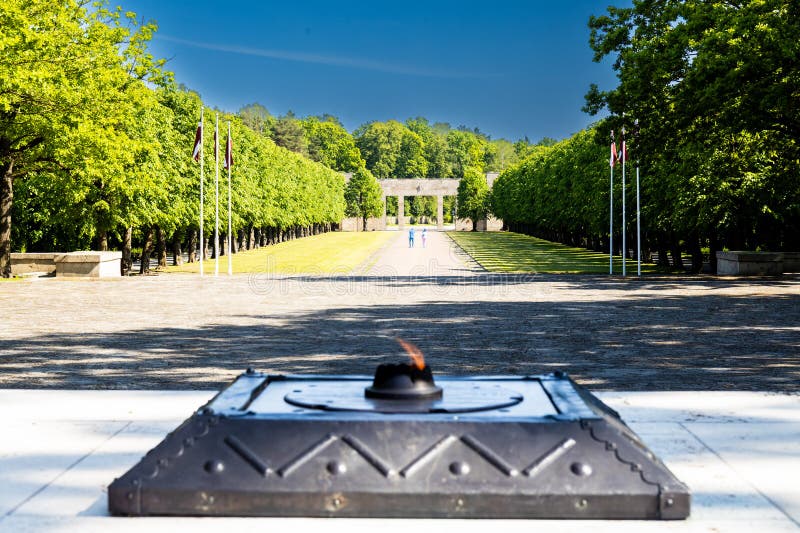 Eternal Flame and Tree-lined Memorial Path at Brothers Cemetery in Riga ...