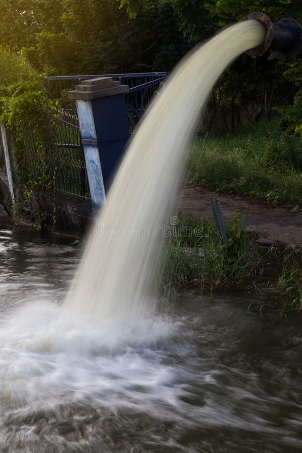 Water Flows from the Pipe into the Canal. Stock Photo - Image of fall ...