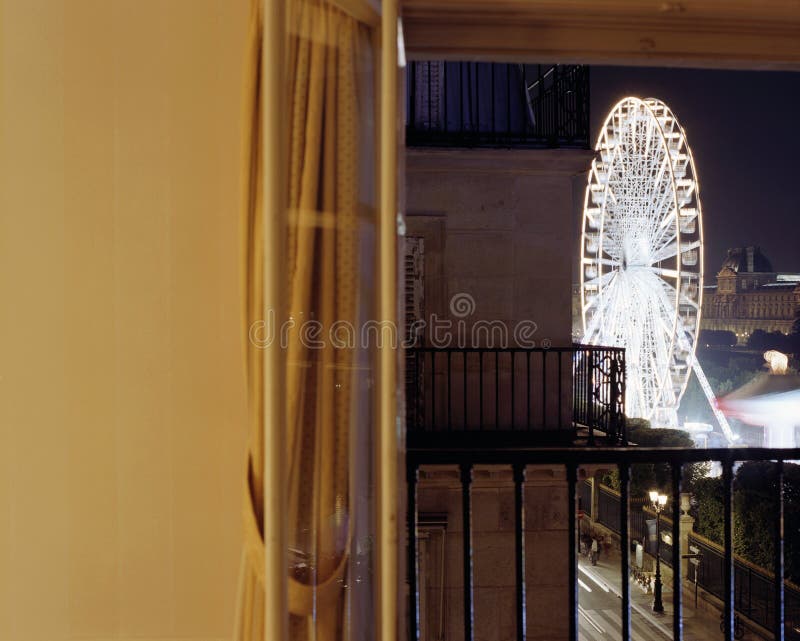 A View of Ferris Wheel and Buildings from a Hotel Room in Paris Stock ...